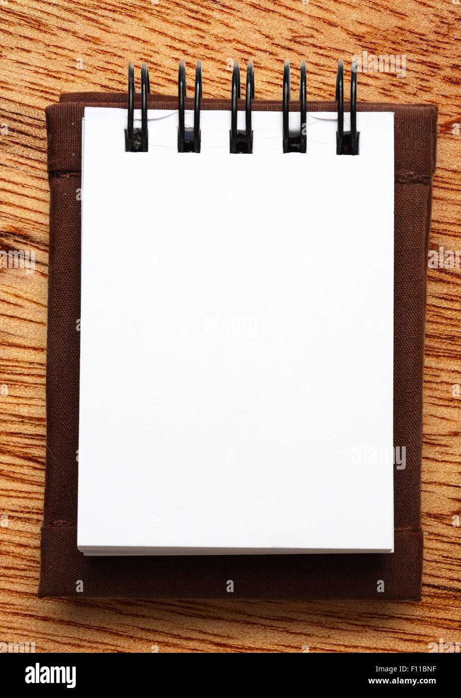 Blank white notepad as background in closeup Stock Photo - Alamy