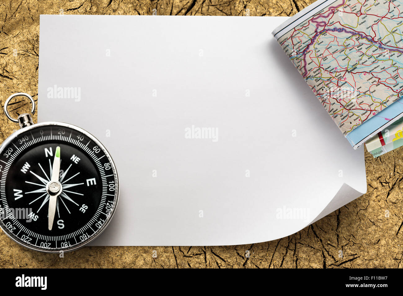 Folded map and compass hi-res stock photography and images - Alamy