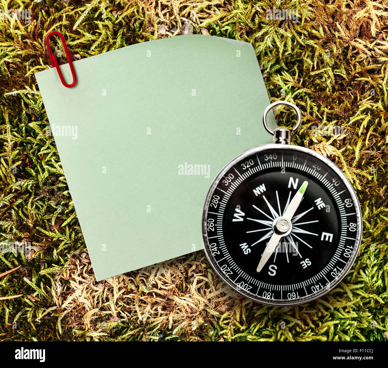 Blank green sticker with red clip and compass Stock Photo - Alamy