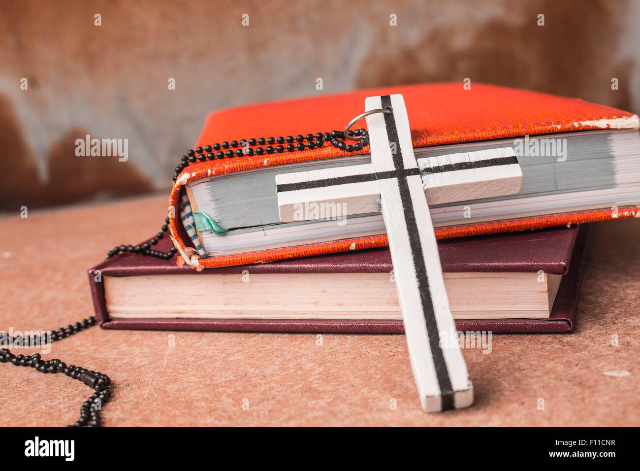 Crosses and books on a wooden table Stock Photo - Alamy