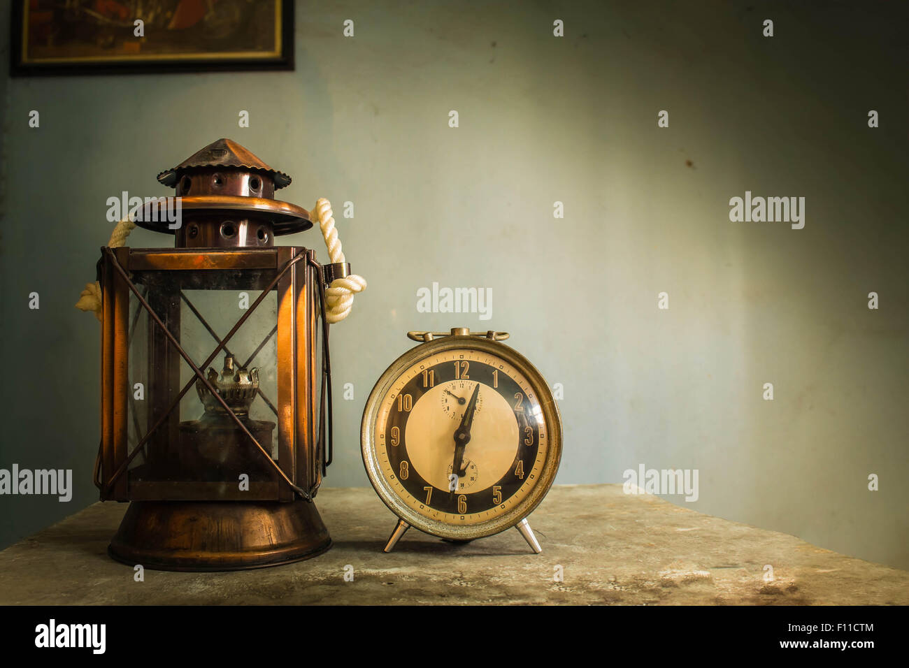 lamp and clock on the table Stock Photo - Alamy
