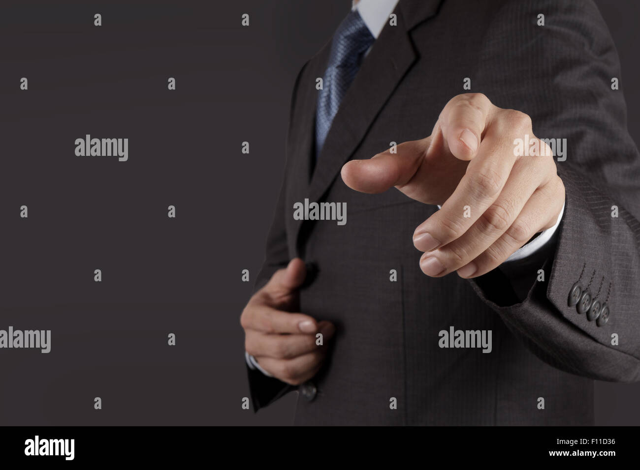 Businessman hand pressing an imaginary button on virtual screen Stock ...