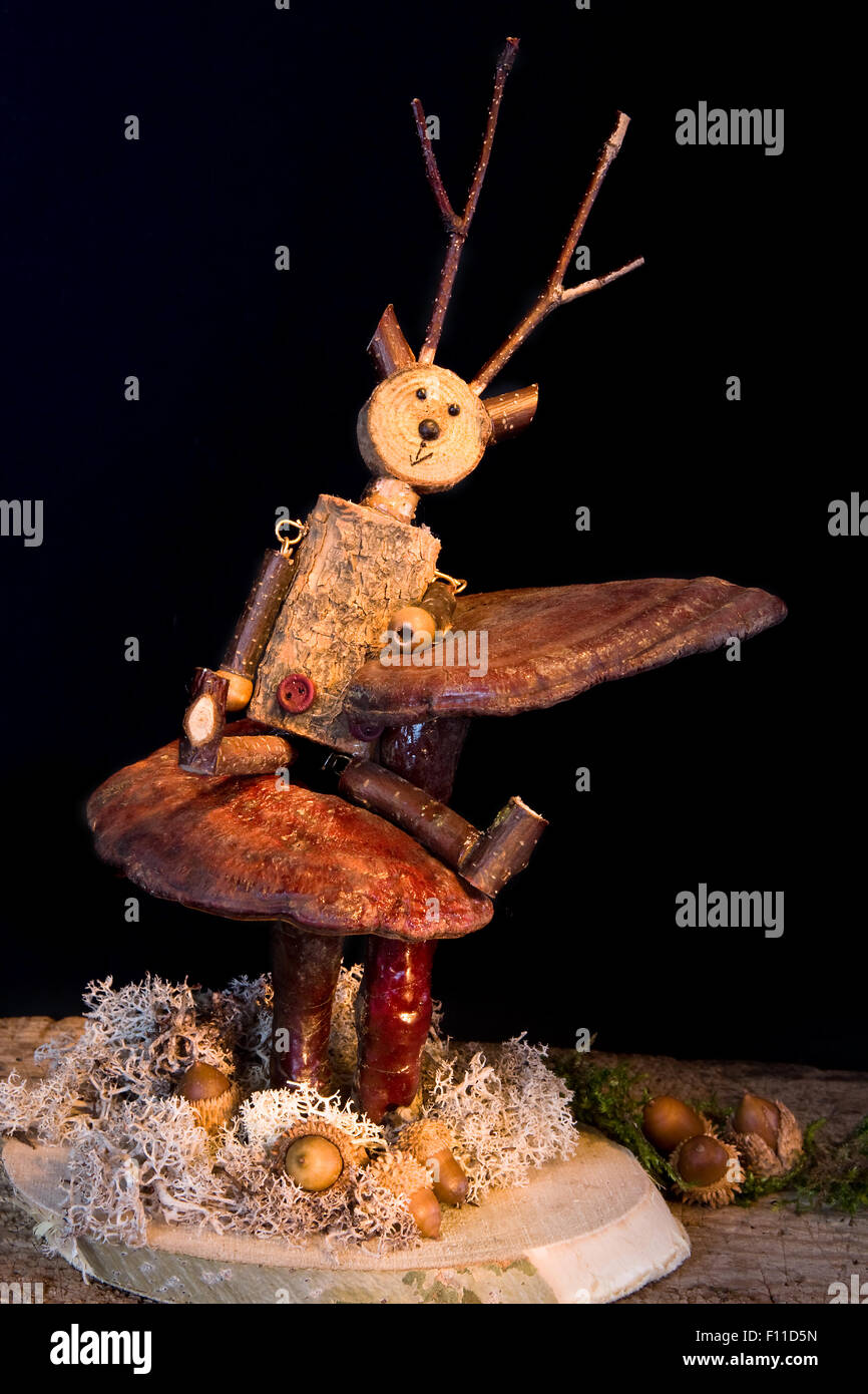 Puppet made of autumn materials sitting on fungi Stock Photo - Alamy