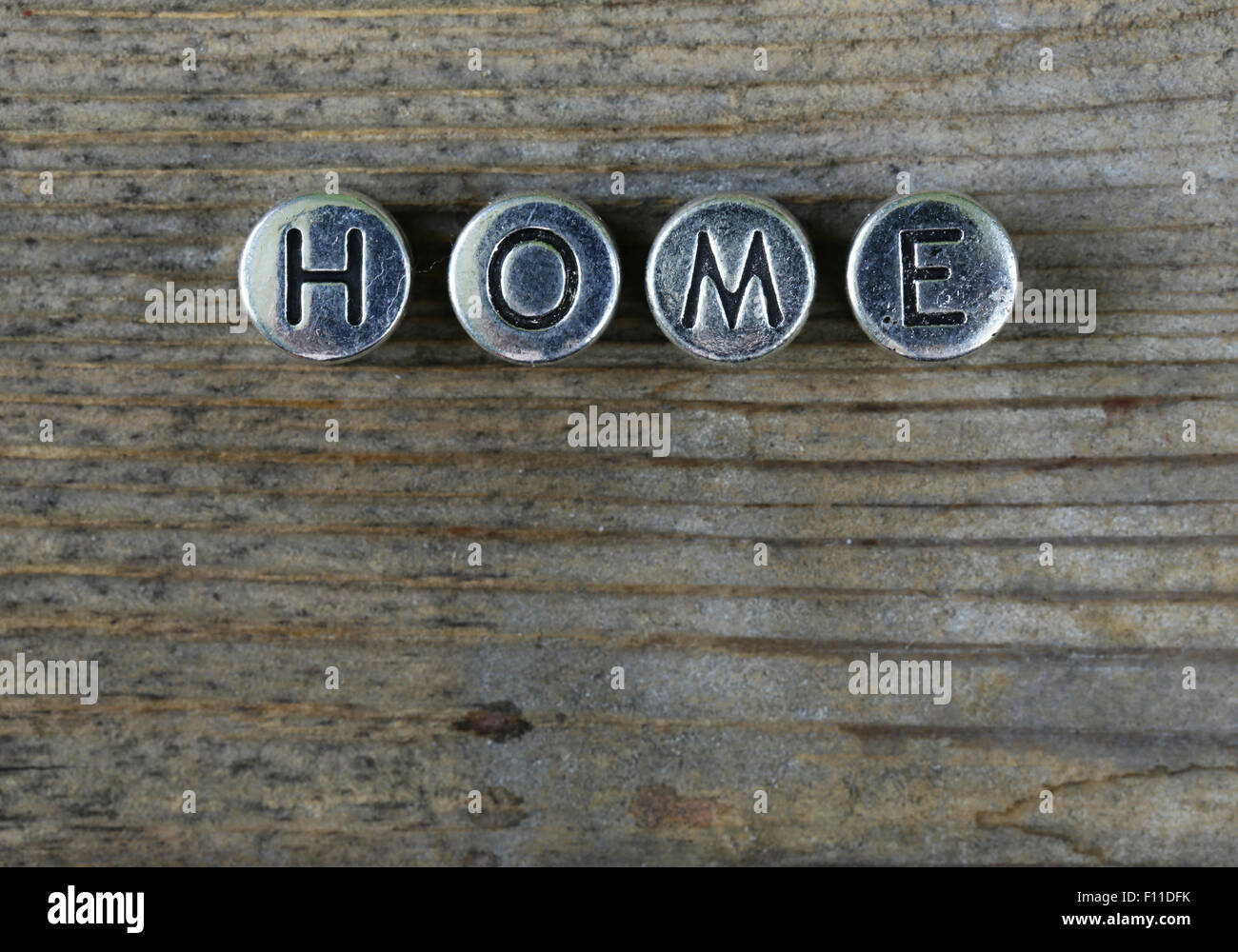 the word "HOME" written in metal letters Stock Photo - Alamy