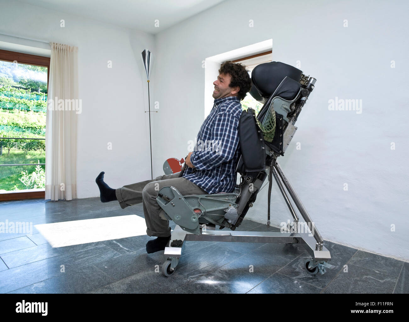 man sitted on a chair Stock Photo - Alamy