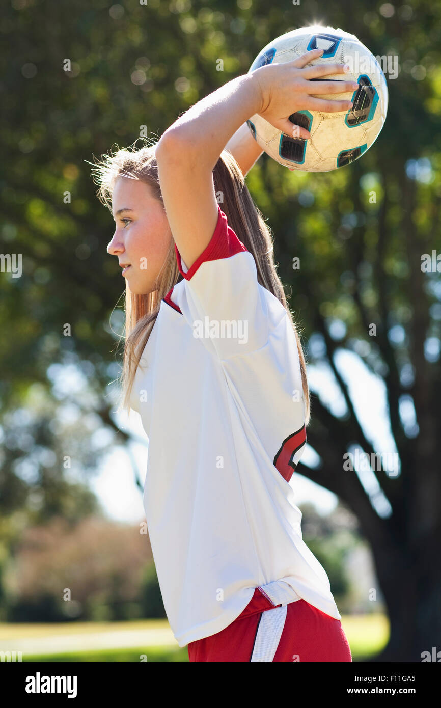 Caucasian soccer player throwing ball Stock Photo - Alamy