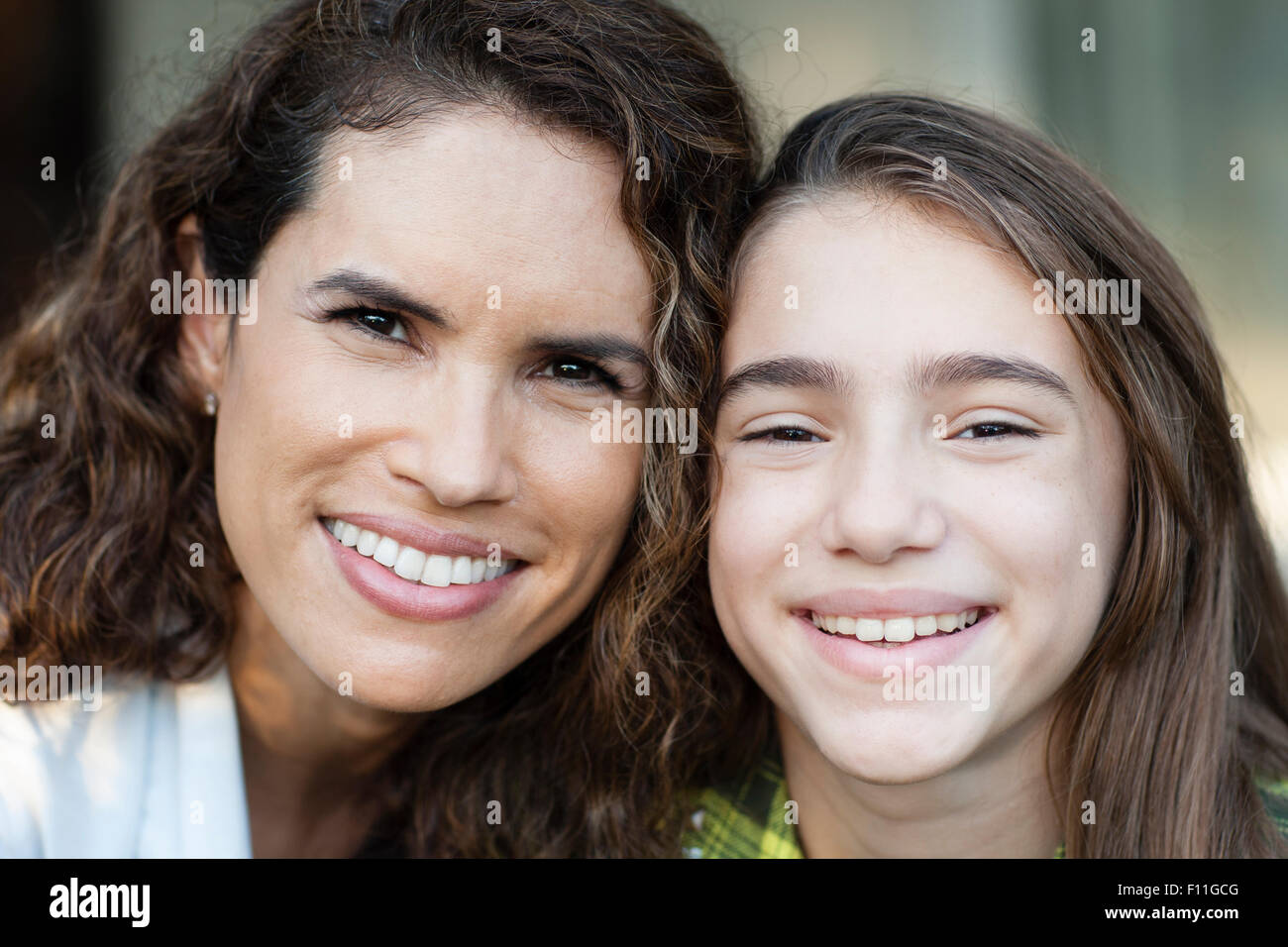 Close up of Hispanic mother and daughter smiling Stock Photo - Alamy