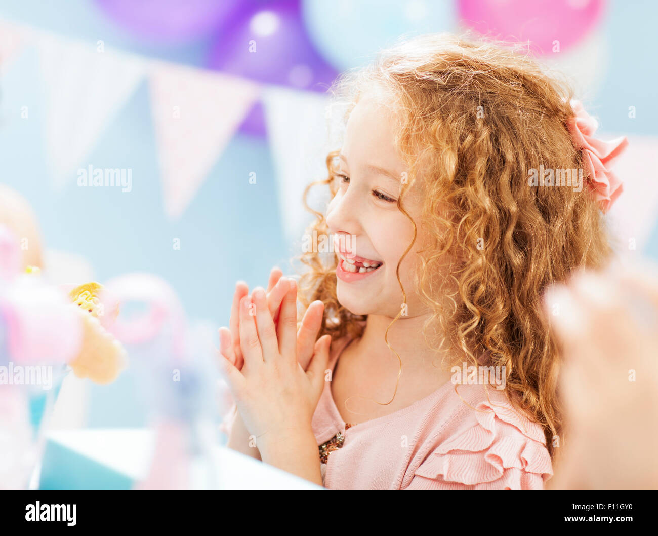 Close up of girl clapping at birthday party Stock Photo - Alamy