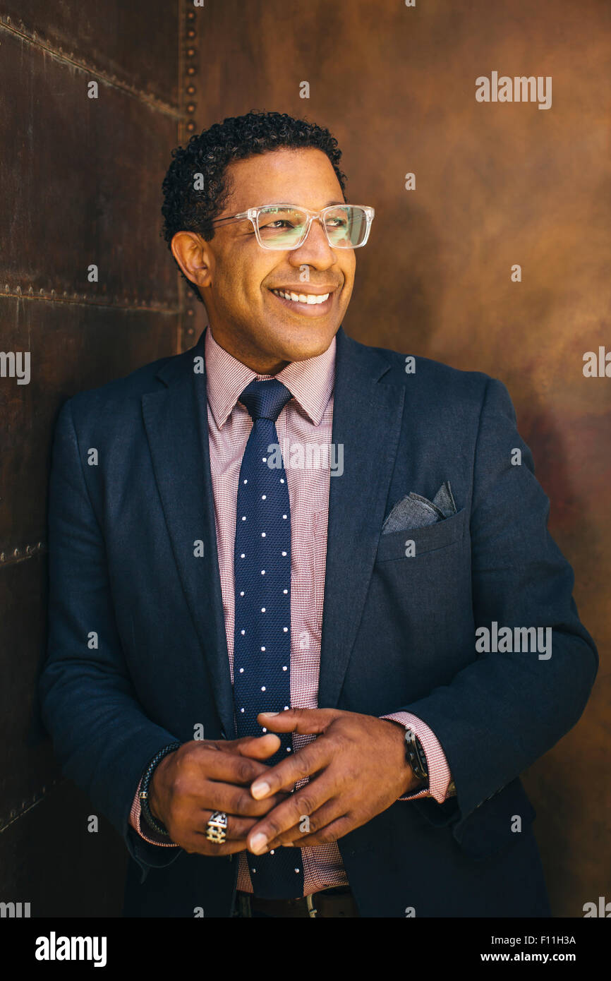 Mixed race businessman smiling Stock Photo - Alamy