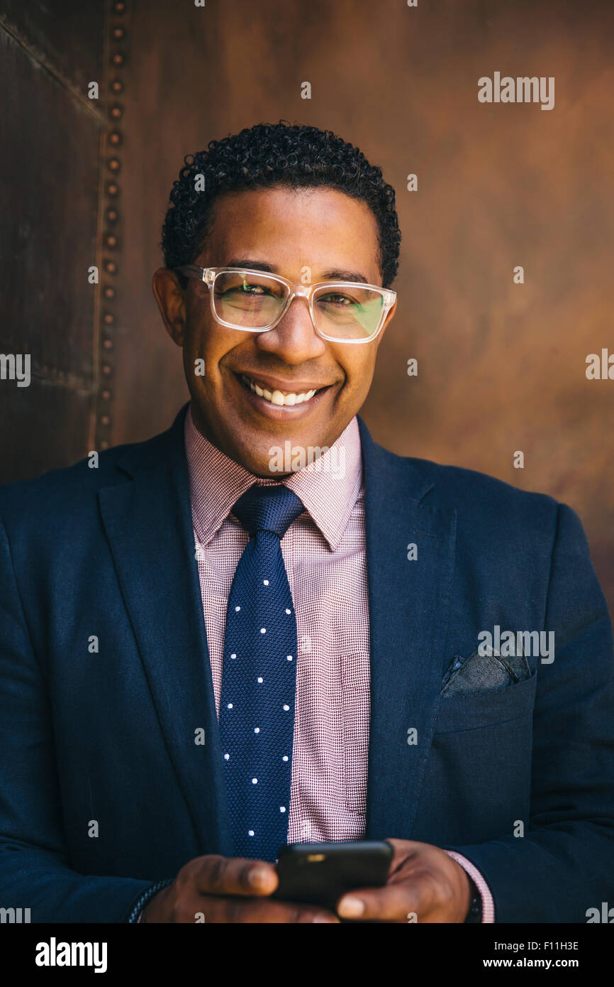 Smiling black mature businessman using hi-res stock photography and ...