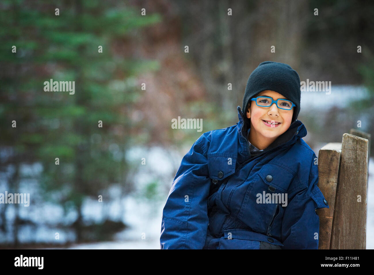 Boy by chair hi-res stock photography and images - Alamy