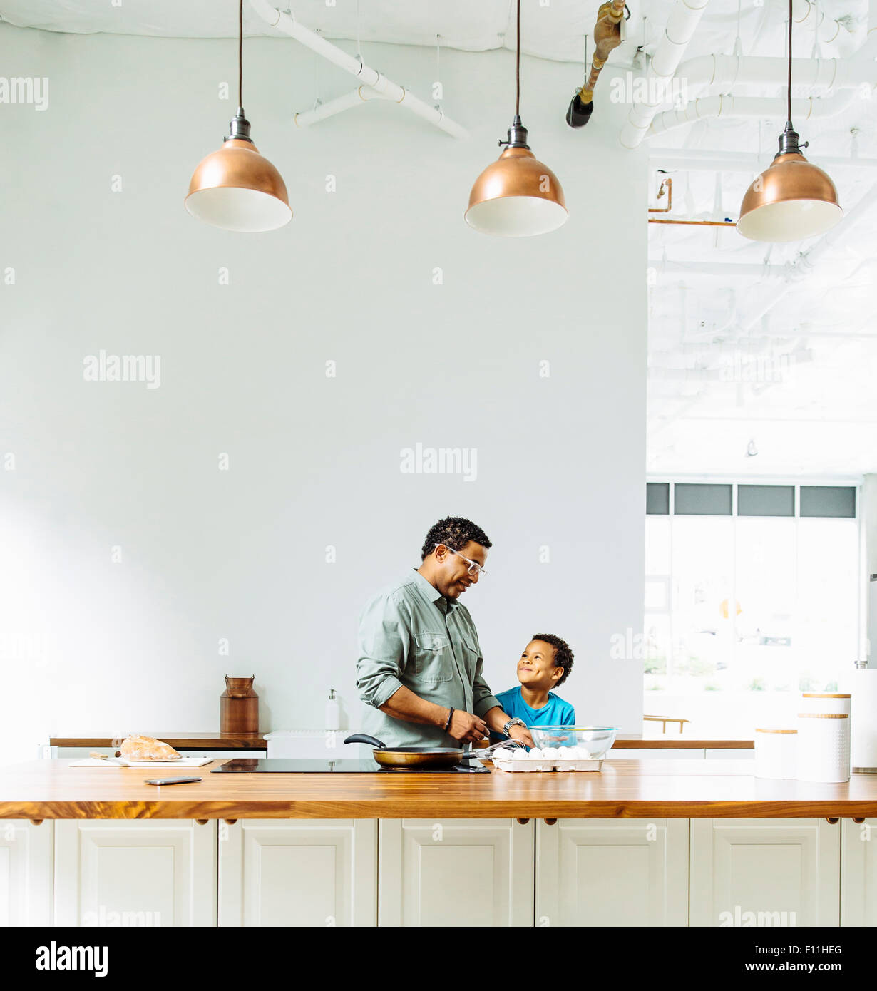 Indian father and son in kitchen hi-res stock photography and images ...