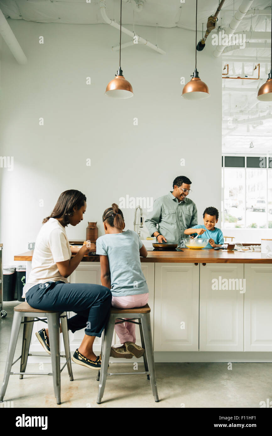 Family cooking in kitchen Stock Photo - Alamy