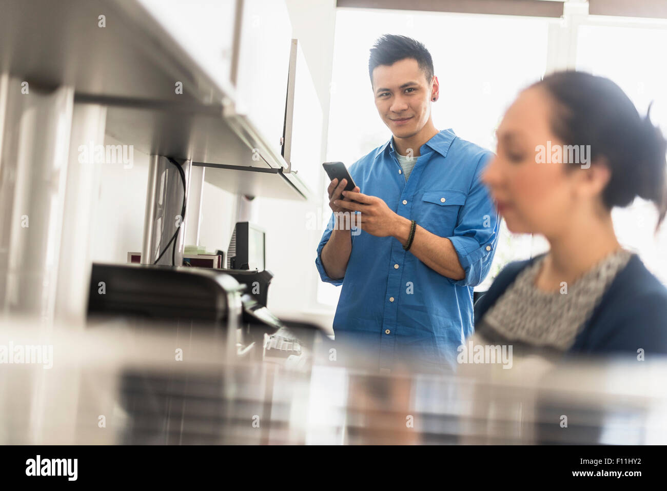 Business people using technology in office Stock Photo - Alamy