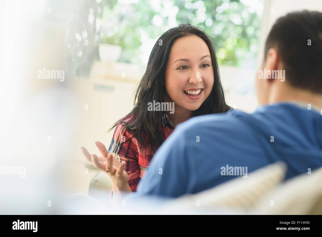 Two people talking sofa hi-res stock photography and images - Alamy