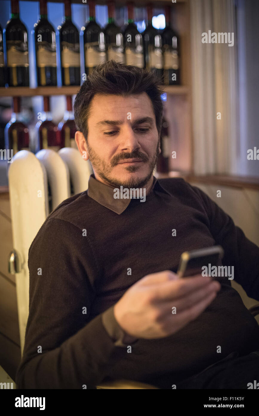 Caucasian man using cell phone Stock Photo - Alamy