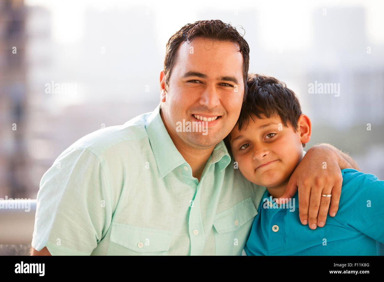 Hispanic Father And Son Embracing High Resolution Stock Photography and ...