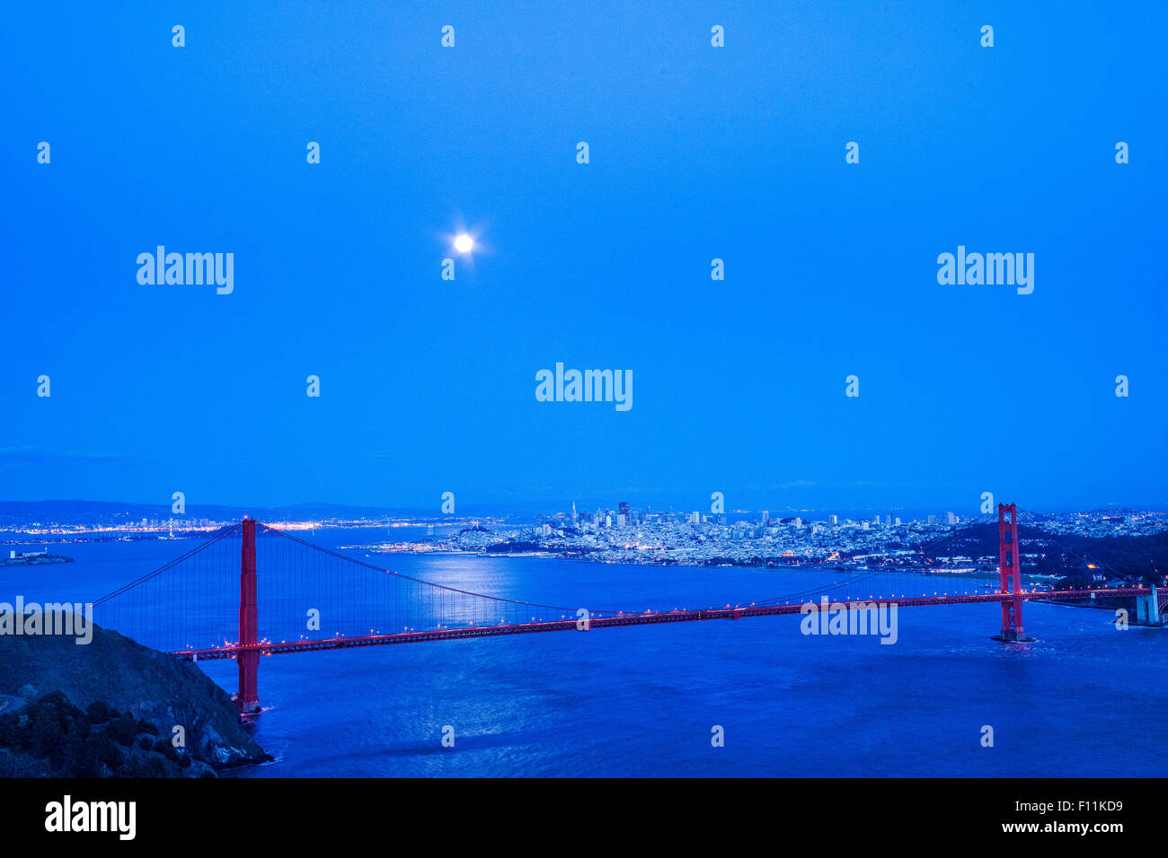 Moon in night sky over Golden Gate Bridge, San Francisco, California ...
