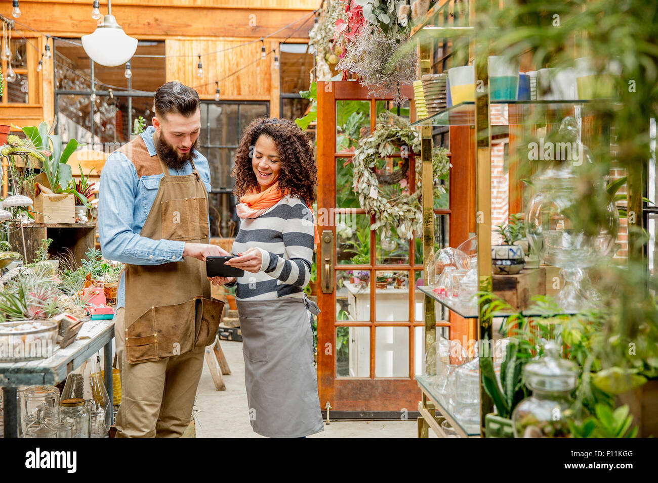 Employees using digital tablet hi-res stock photography and images - Alamy