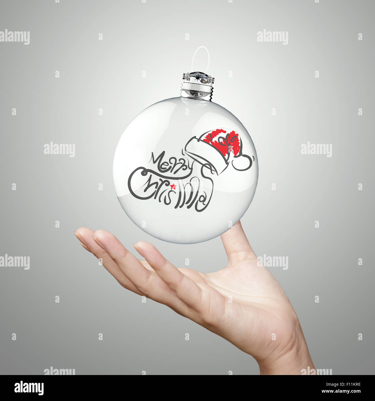 hand showing Merry Christmas in ornament ball Stock Photo - Alamy