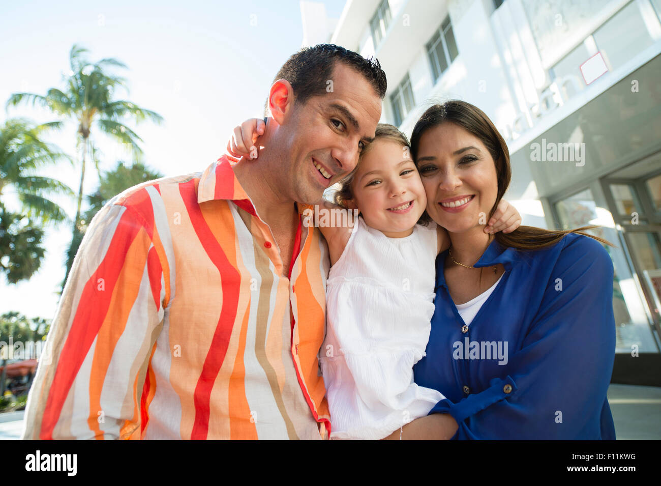 Close up of Hispanic family hugging outdoors Stock Photo - Alamy