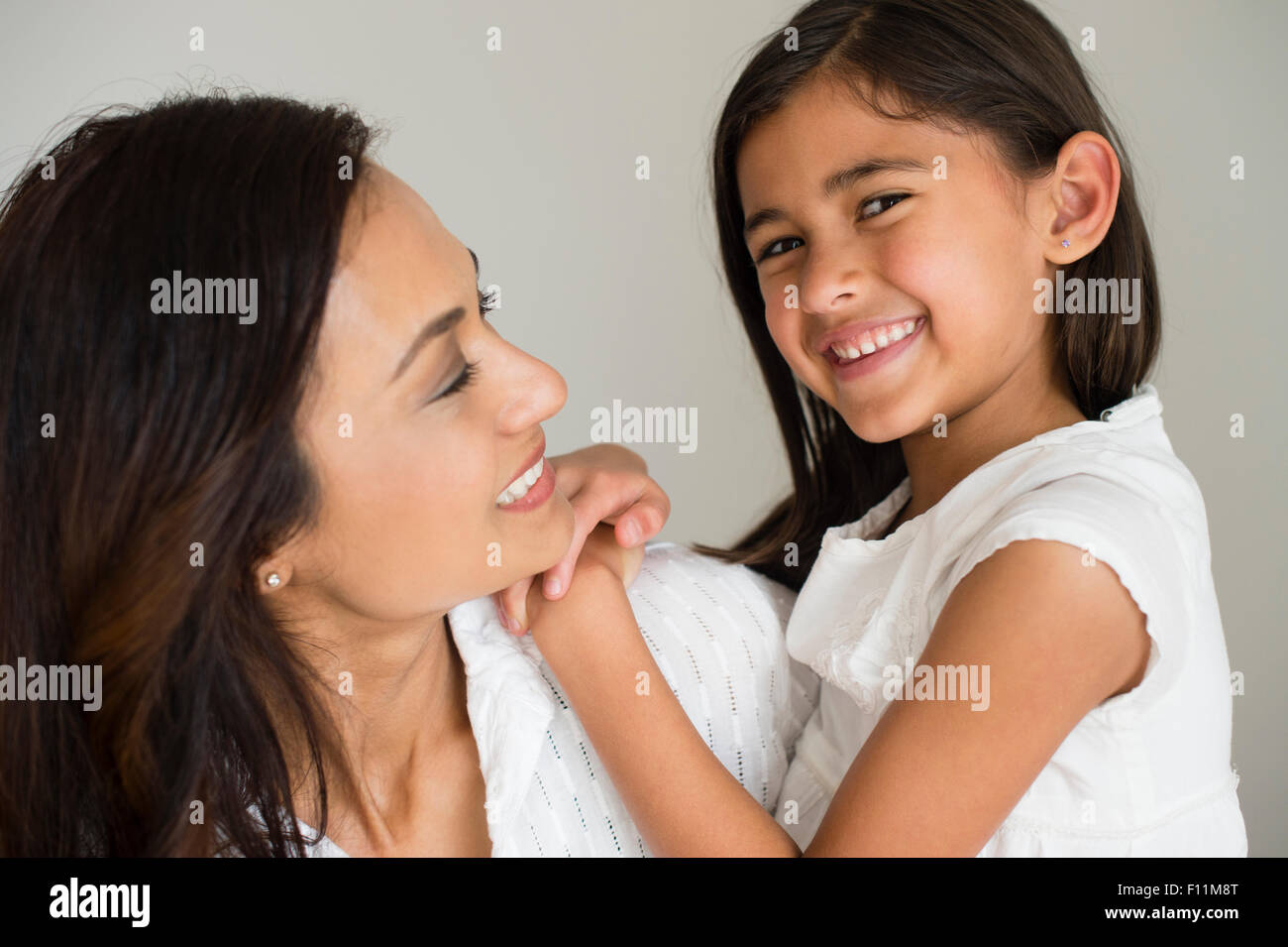 Close up of mother and daughter hugging Stock Photo - Alamy