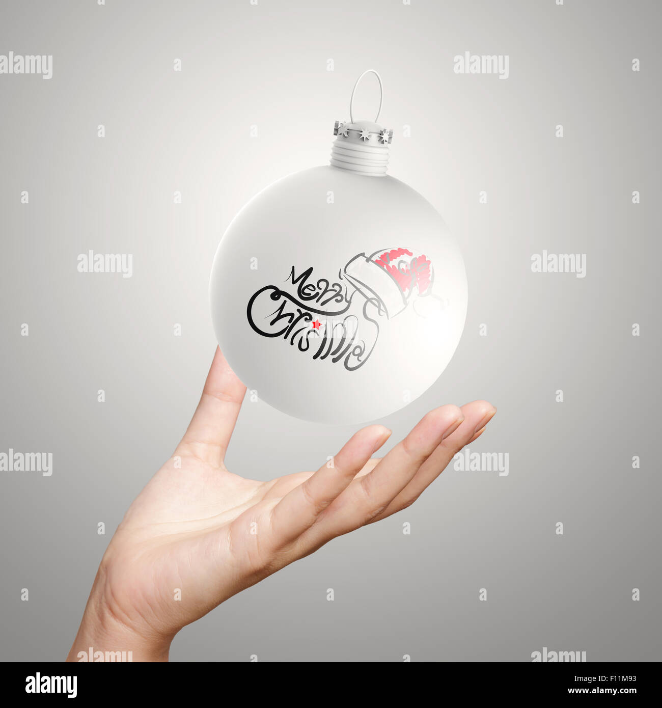 hand showing Merry Christmas in ornament ball Stock Photo - Alamy