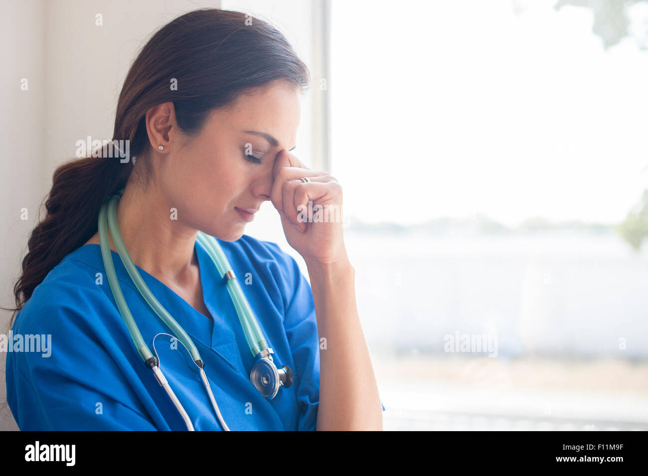 Frustrated female doctor head hi-res stock photography and images - Alamy