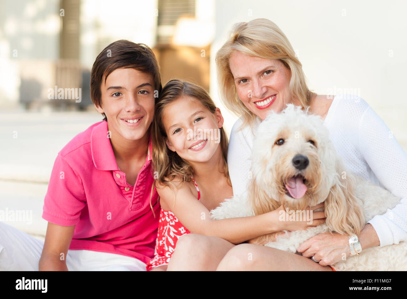Hispanic boy and girl caring dog hi-res stock photography and images ...