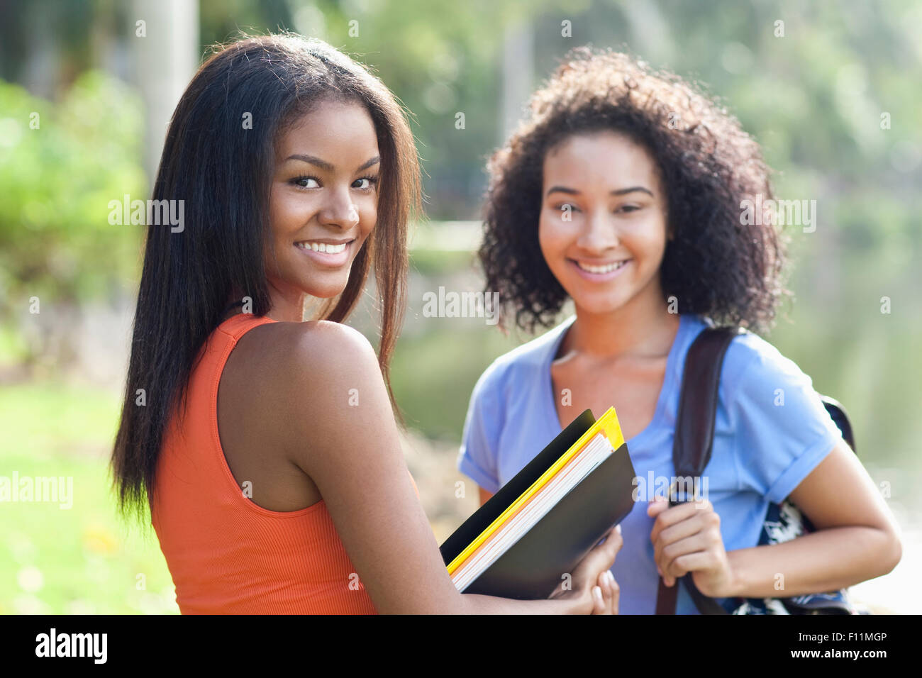 Black students smiling outdoors Stock Photo - Alamy