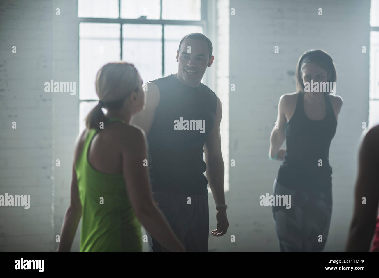 Athletes talking in gym Stock Photo - Alamy
