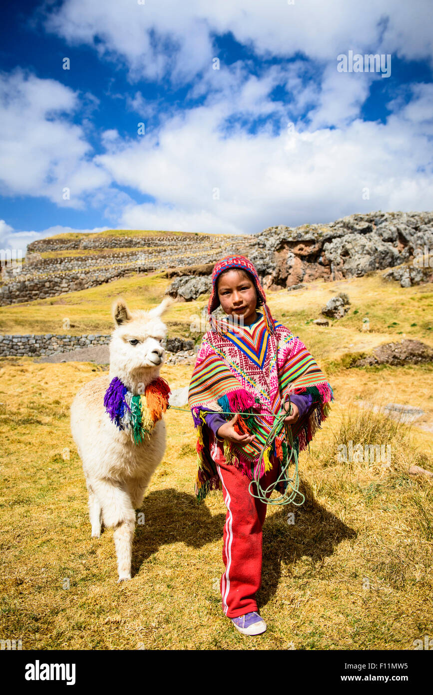 Hispanic girl walking llama in rural landscape Stock Photo - Alamy