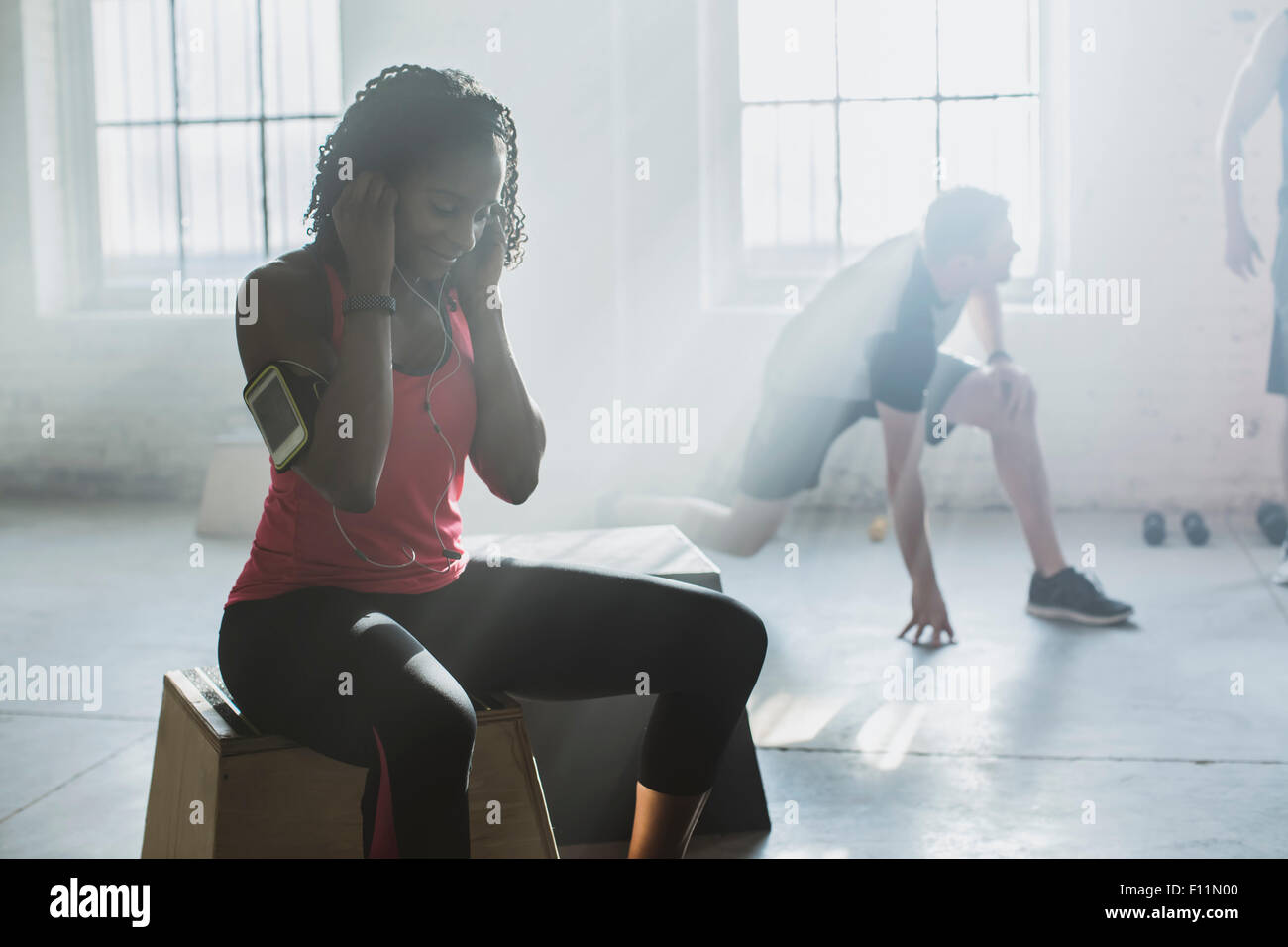 Athletes resting in gym Stock Photo - Alamy
