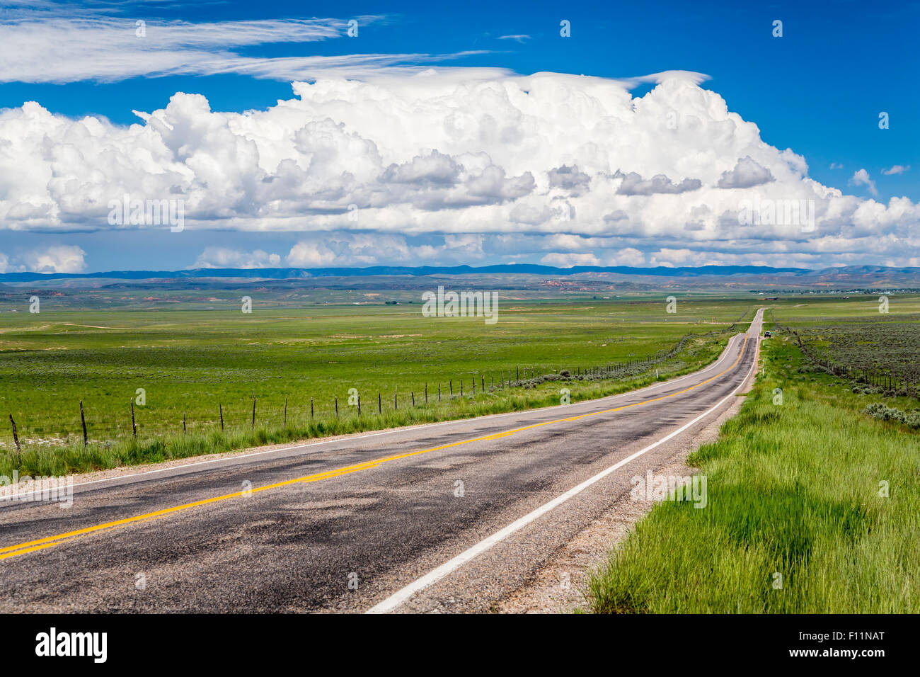 A roadway with storm clouds forming in rural Utah, USA Stock Photo - Alamy