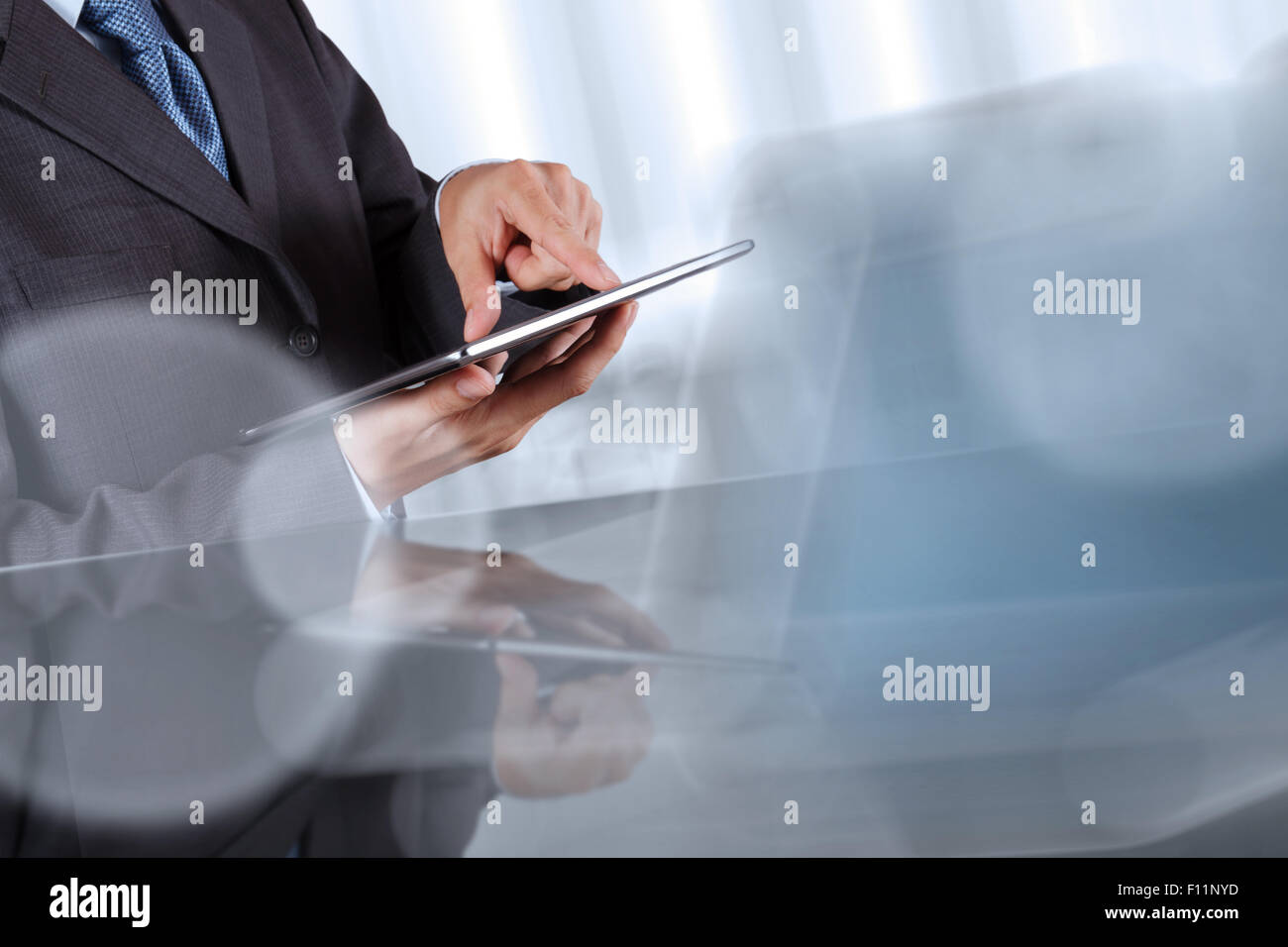 businessman hand pressing a touchscreen button on server background ...