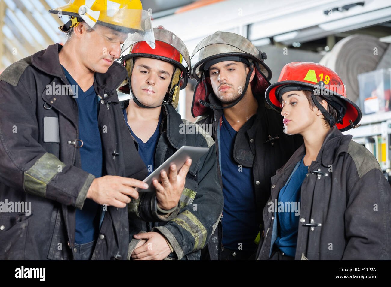 Firefighters Using Tablet Computer Stock Photo - Alamy