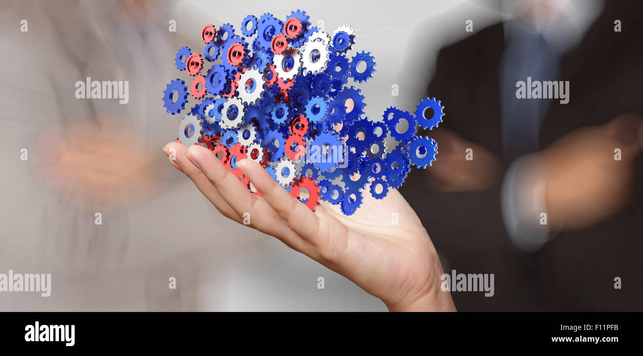 businessman hand showing gears cogs to success concept Stock Photo - Alamy