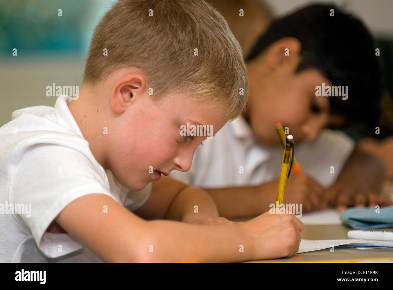 Primary school pupil's in classroom studying, UK Stock Photo - Alamy