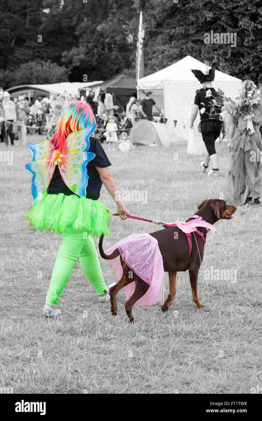 Woman and dog dressed as fairies with tutus and wings at the New Forest ...