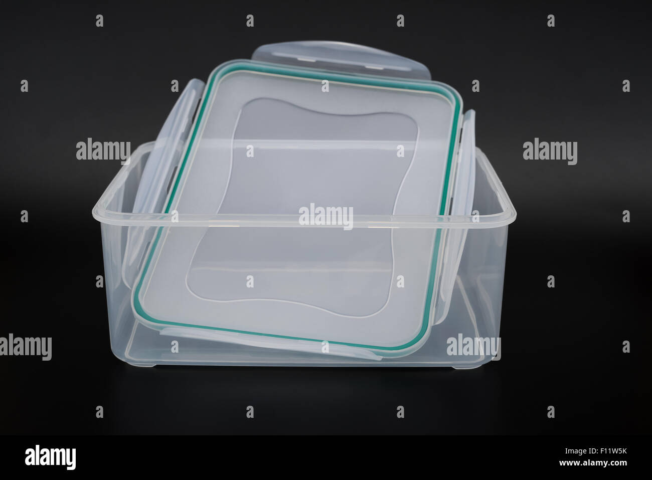 translucent storage box on black Stock Photo - Alamy