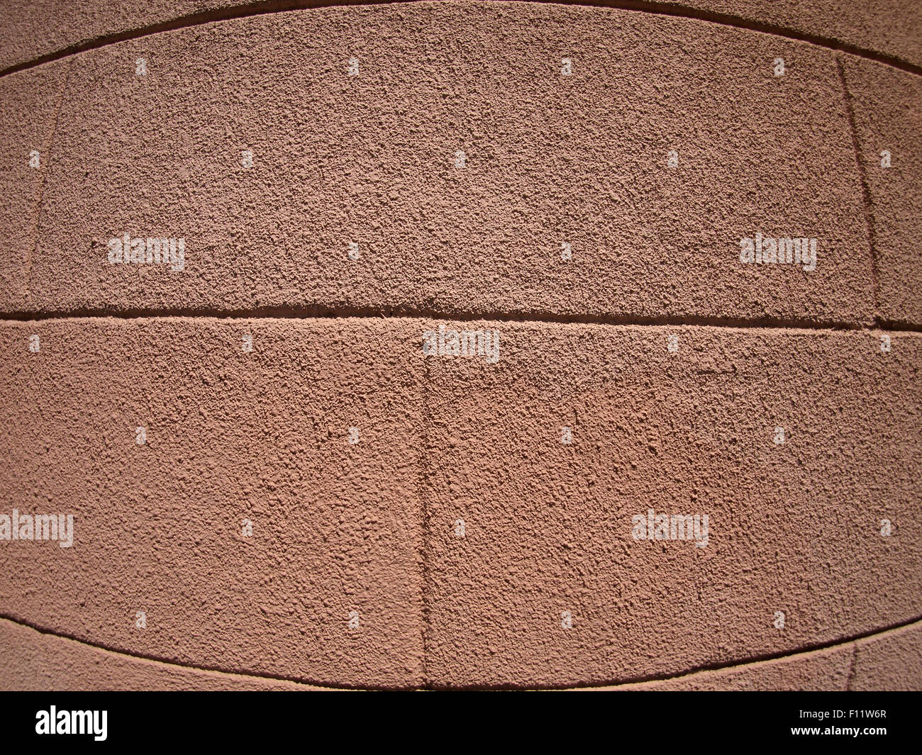 Detail of a decorative wall with a rough coating of cement with wide ...