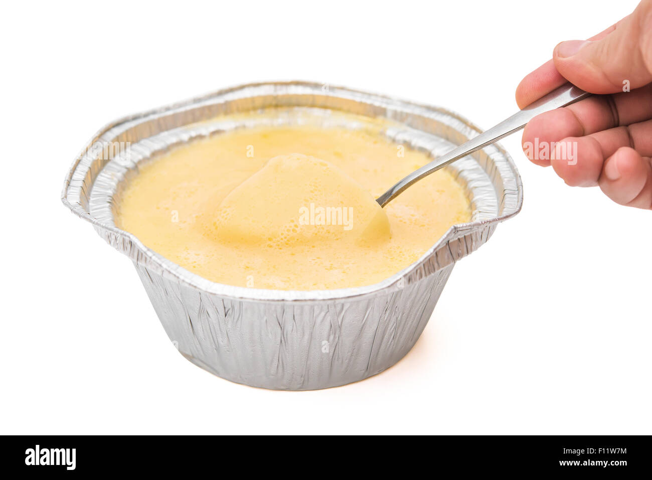 spoon taking out fresh pudding with clipping path Stock Photo - Alamy