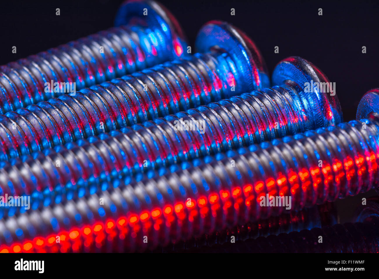 Macro-photo of small screw threaded bolts Stock Photo - Alamy