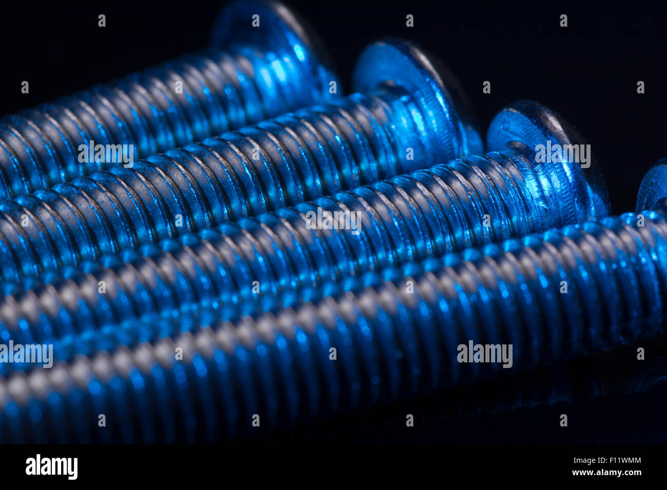 Macro-photo of small screw threaded bolts Stock Photo - Alamy