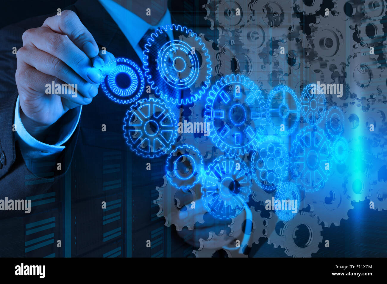 businessman hand draws gear to success concept Stock Photo - Alamy