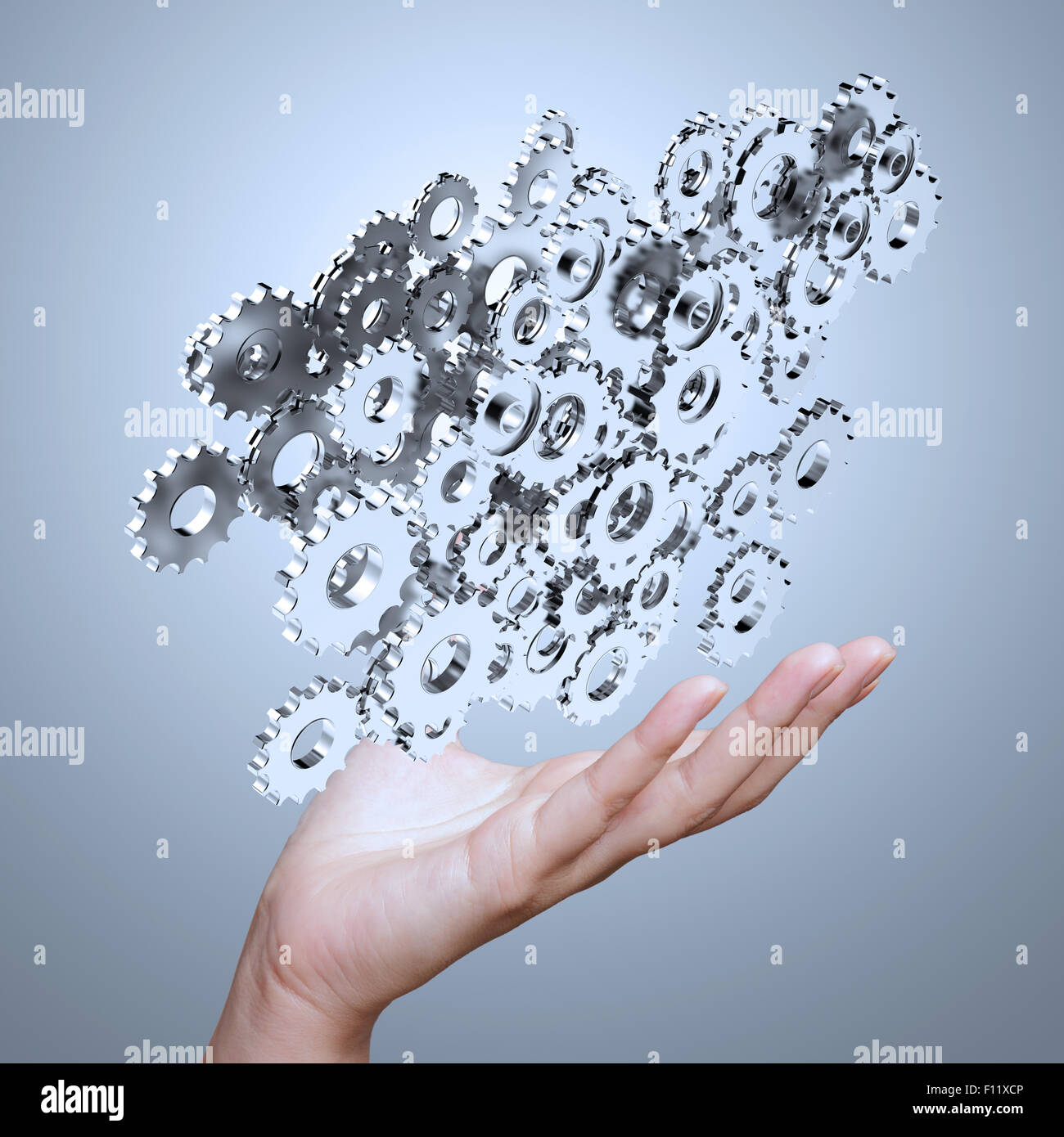 businessman hand showing gears cogs to success concept Stock Photo - Alamy