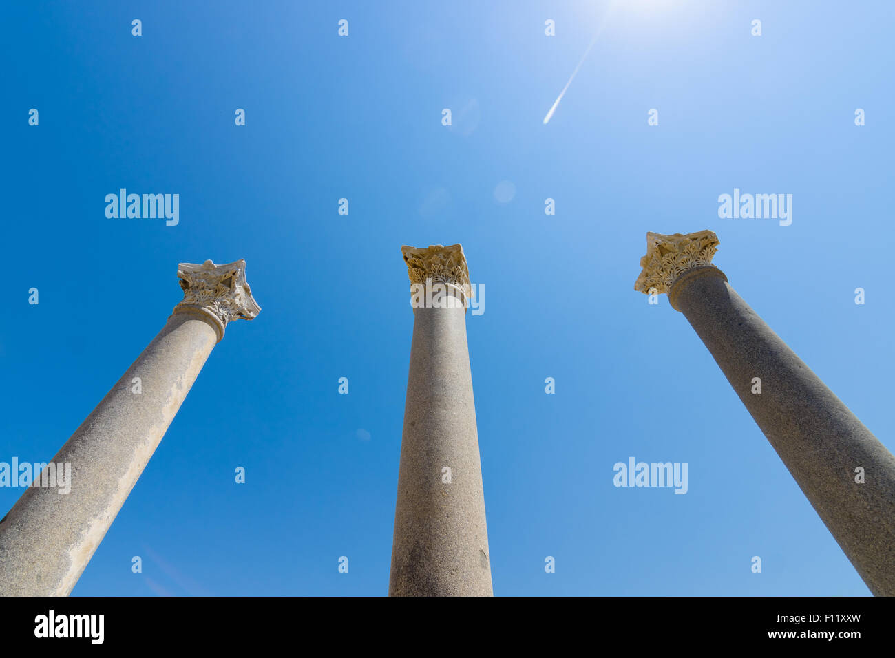 Ancient ruins of Perge on a background of blue sky. Optical glare from ...