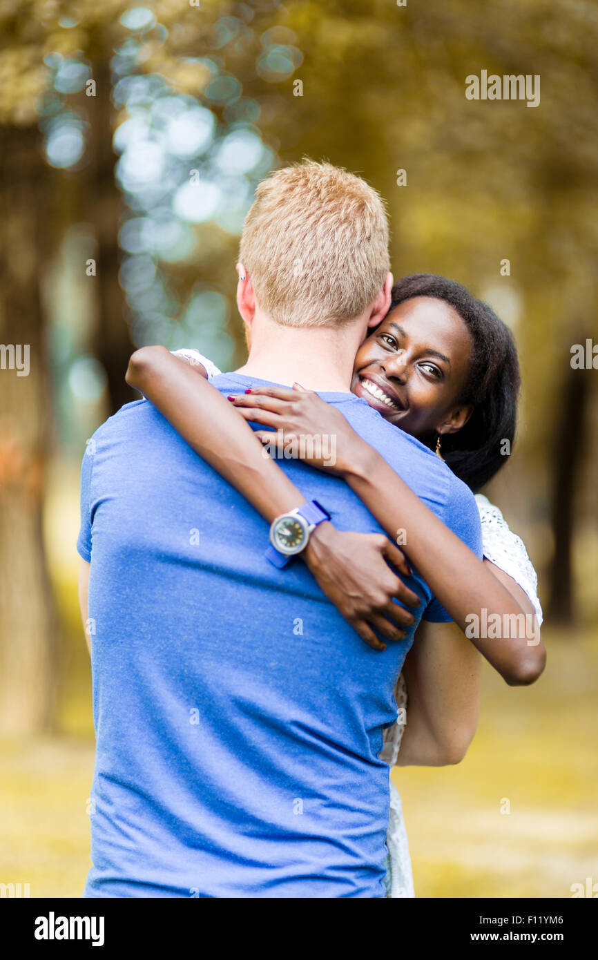 Couple in love hugging peacfully outdoors and being truly happy ...