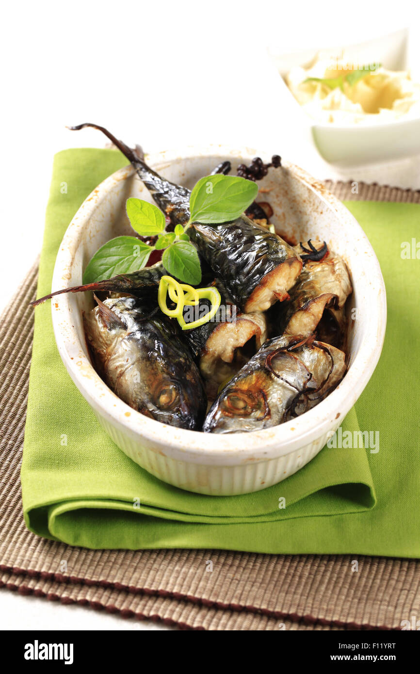 Pieces of baked mackerel in a casserole dish Stock Photo - Alamy