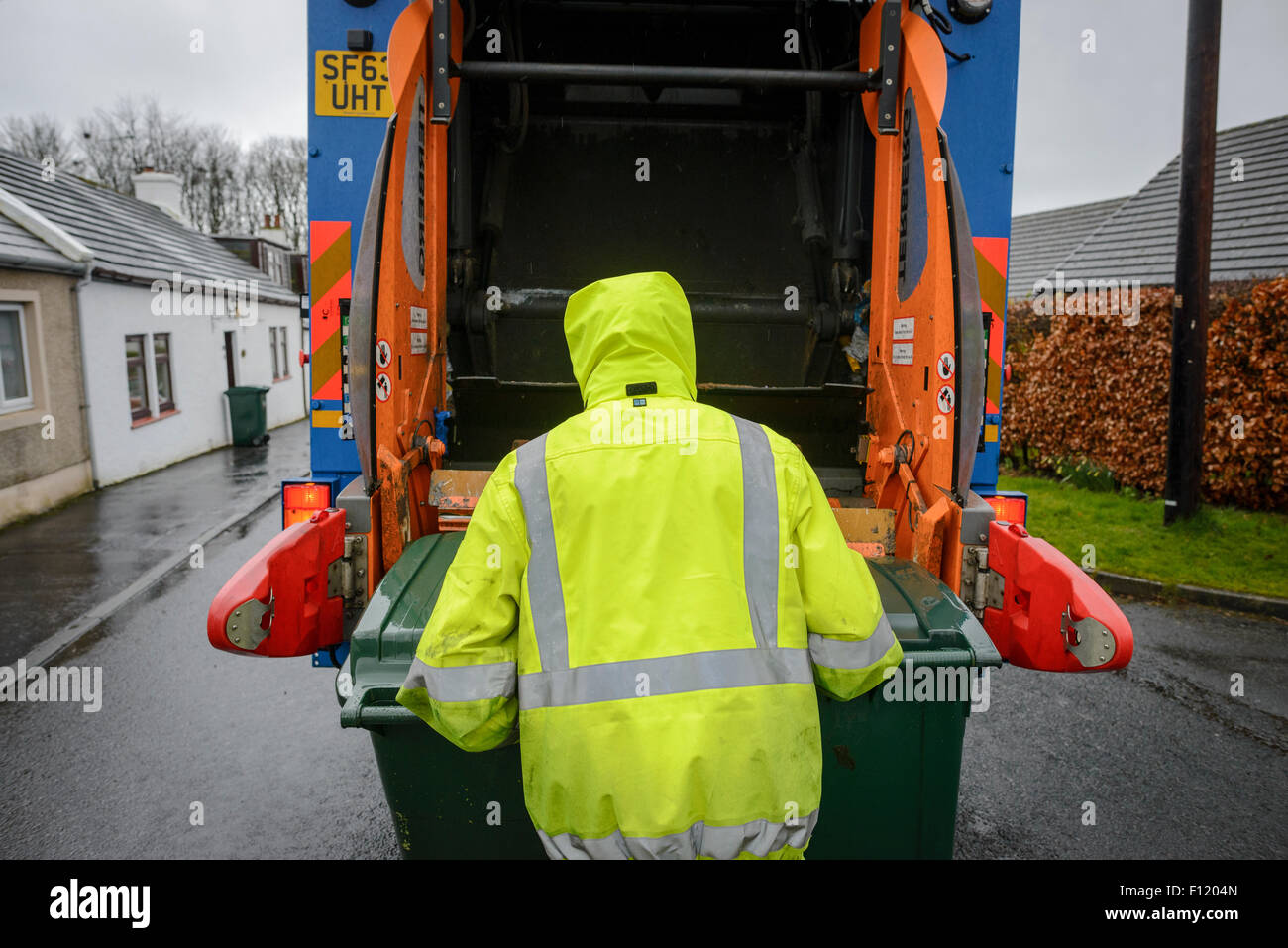 Bin men on thier refuse collection round in a small town in Scotland ...